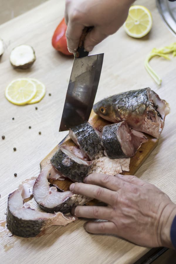 Fish. There is a Raw Fish Cut into Pieces on the Kitchen Board Stock ...