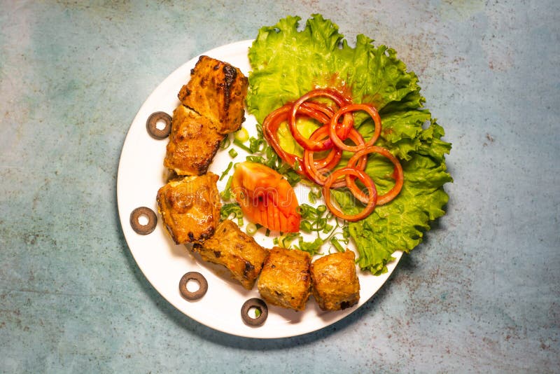 Fish Tikka Boti Kabab Platter with Lime and Salad in a Dish Top View of ...