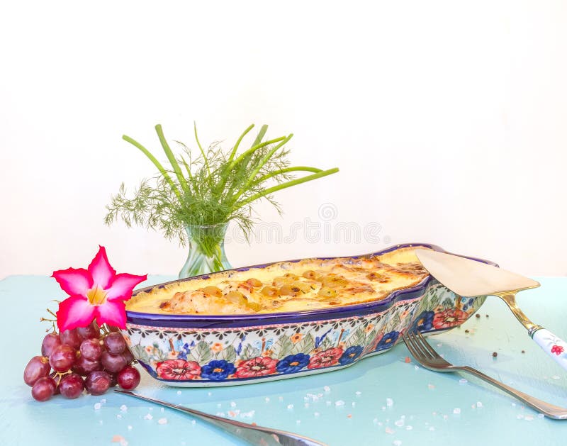 Fish Under Chees Source Over White with Grapes, Flower Stock Image ...