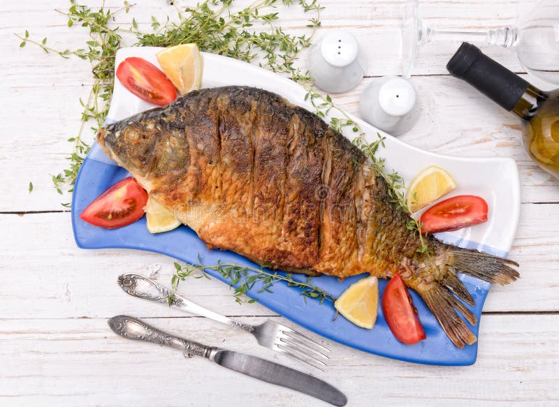 Fish on a White Wooden Table. Stock Photo - Image of lunch, plate: 55898960