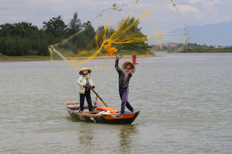 Fisher casting his net editorial photo. Image of coastline - 20701491