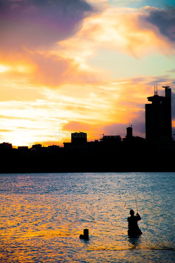 Fisher Man Fishing in a River at Sunset Stock Image - Image of leisure ...