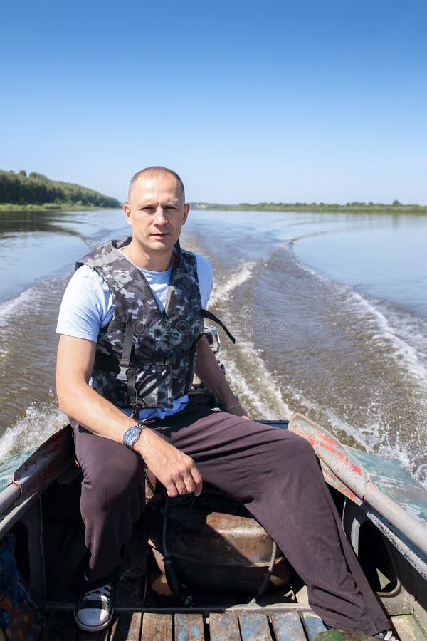 Fisherman on Boat Moves in River Stock Image - Image of freshwater ...