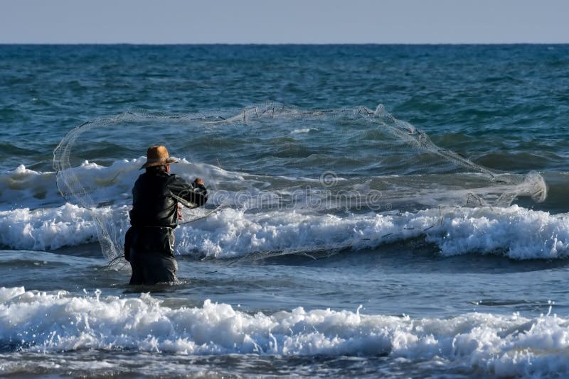 Fisherman Casting Net during Daylight in Delta of the River Alpheios in ...
