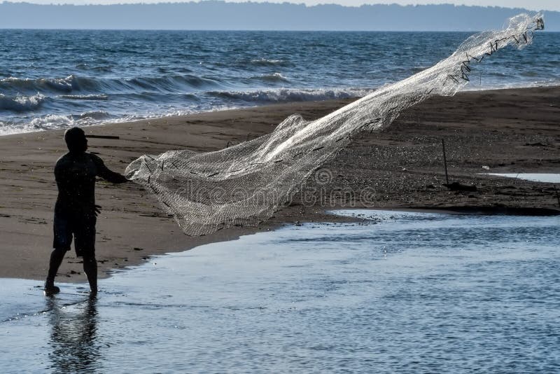 Fisherman Casting Net during Daylight in Delta of the River Alpheios in ...