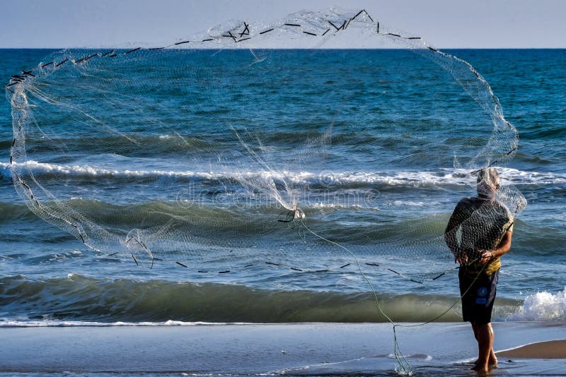 Fisherman Casting Net during Daylight in Delta of the River Alpheios in ...