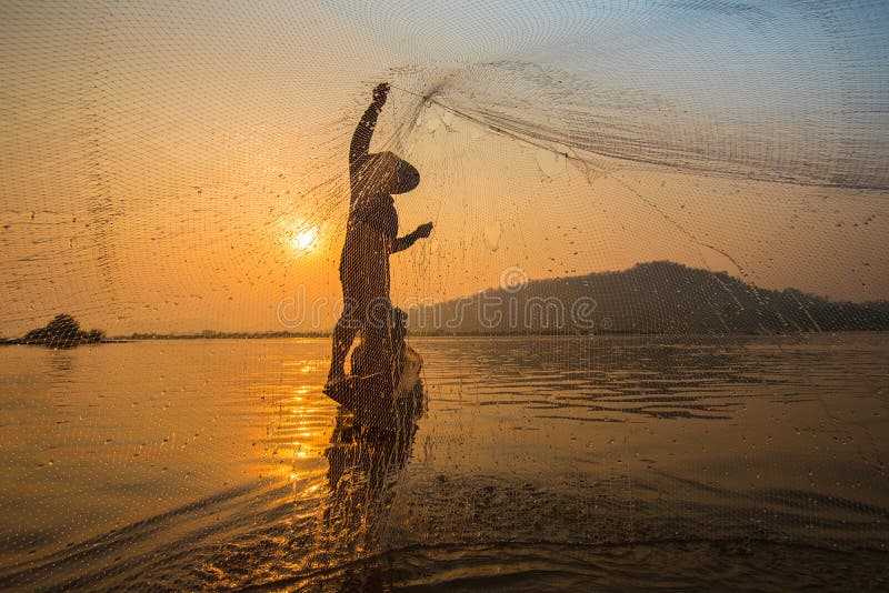 Fisherman Casting Net at Sunrise Stock Image - Image of evening, rising ...