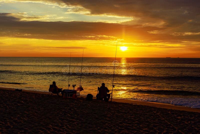 A Fisherman Catch Fish on Ocean in Morning during Sunrise Stock Photo ...