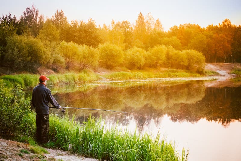 Fisherman Catches of Fish on River Stock Image - Image of nature, sport ...