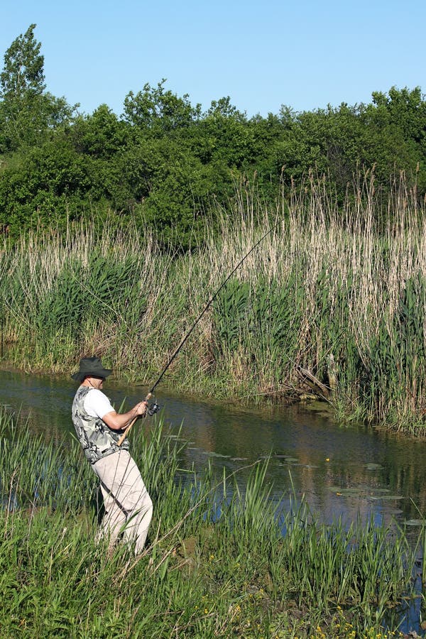 Fisherman catching fish stock image. Image of fish, freshwater - 53984759