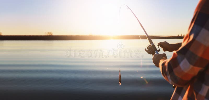 Fisherman Catching Fish with Rod at Riverside, Closeup View with Space ...