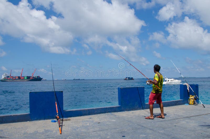 Fisherman Catching Fish Using Three Rods Stock Photos - Free & Royalty ...