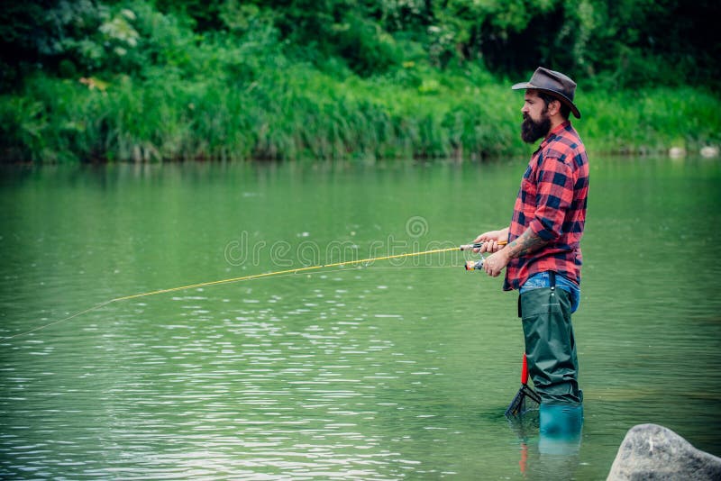 Fisherman Caught a Fish. Man Angler Fishing on River. Stock Photo ...