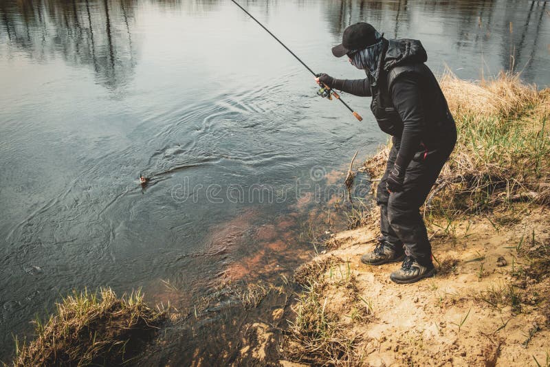 Fisherman Caught a Fish on the River Bank Stock Photo - Image of ...