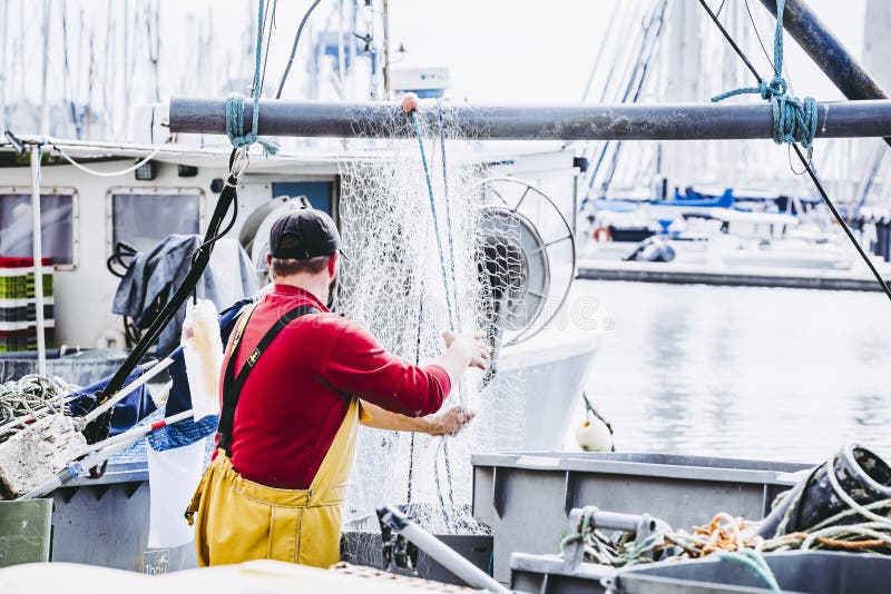 Fisherman Cleaning and Storing Fishing Nets after Fishing Editorial ...