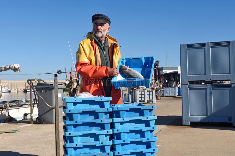 A Fisherman with a Fish Box Inside a Fishing Boat Stock Photo - Image ...