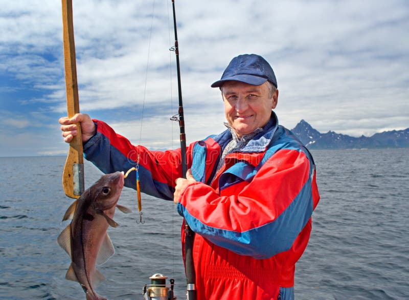 Fisherman with a Fish on Lofoten Island Stock Photo - Image of leisure ...
