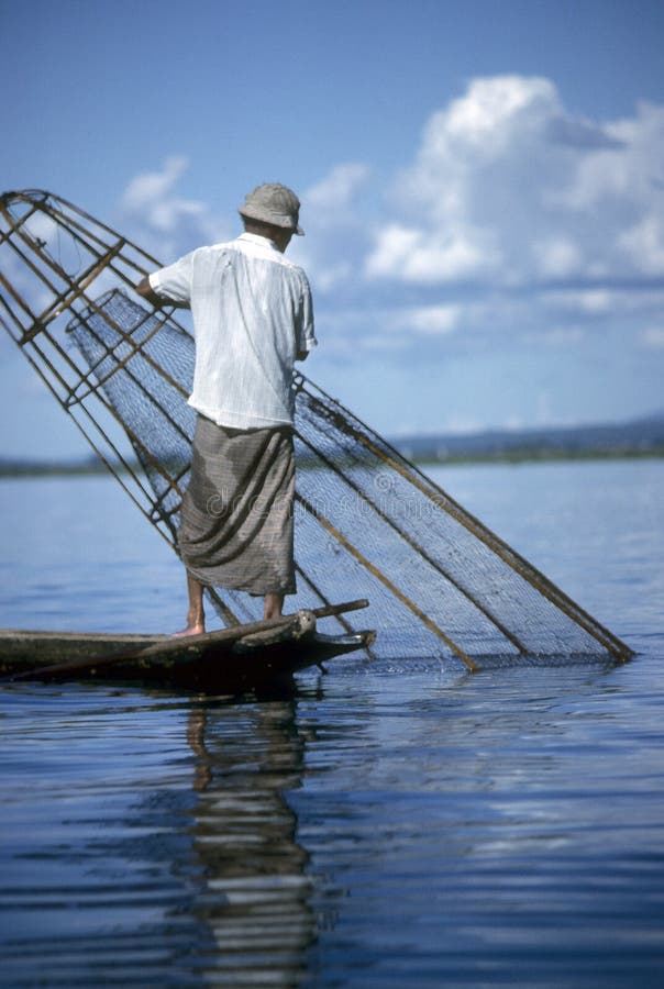 Fisherman with fish trap, stock image. Image of water - 2180431