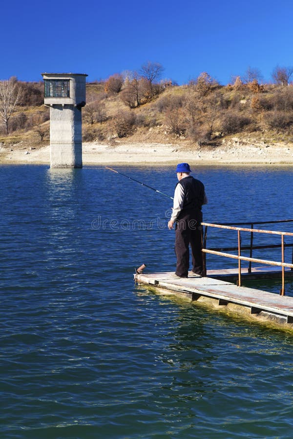 Fisherman Fishing on Blue Lake Stock Photo - Image of dawn, hobby: 65253616