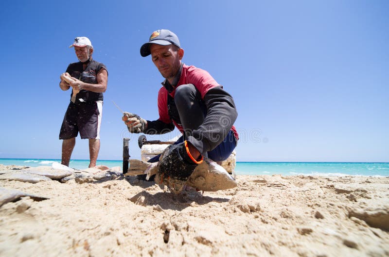 A Fisherman Guts a Freshly Caught Fish on a Cuban Beach 04 28 2022 ...
