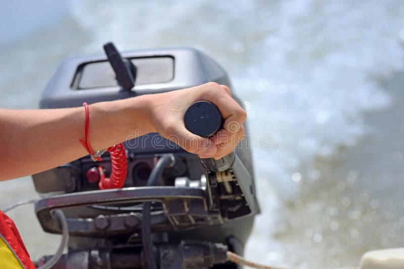 Fisherman Hand and Boat Engine Stock Photo - Image of inflatable, motor ...