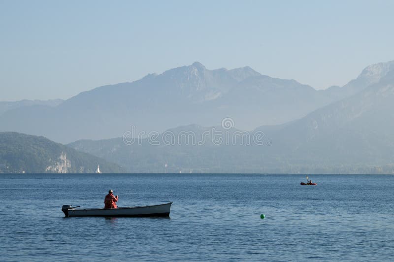 Fisherman on His Boat on Lake Annecy Stock Photo - Image of annecy ...