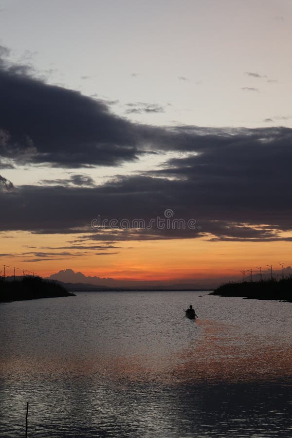 Fisherman on His Boat at Sunset. Fishermen Boat at Sunset Stock Image ...