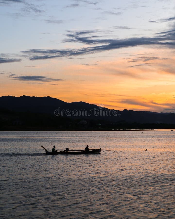 Fisherman on His Boat at Sunset. Fishermen Boat at Sunset Stock Image ...