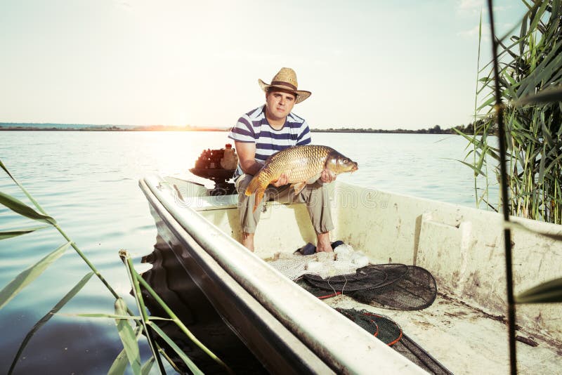 Fisherman Holding a Big Fish Stock Image - Image of river, nature: 94264077