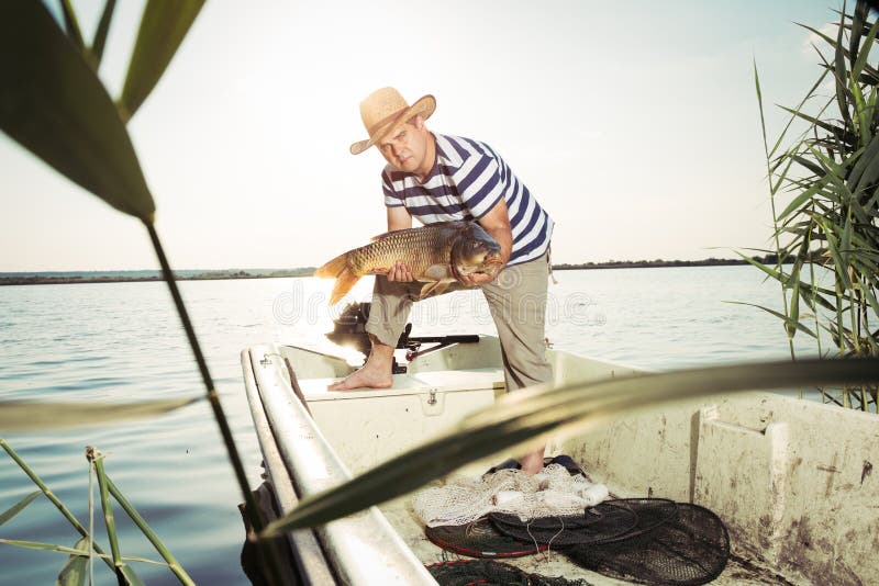 Fisherman Holding a Big Fish Stock Image - Image of season, travel ...