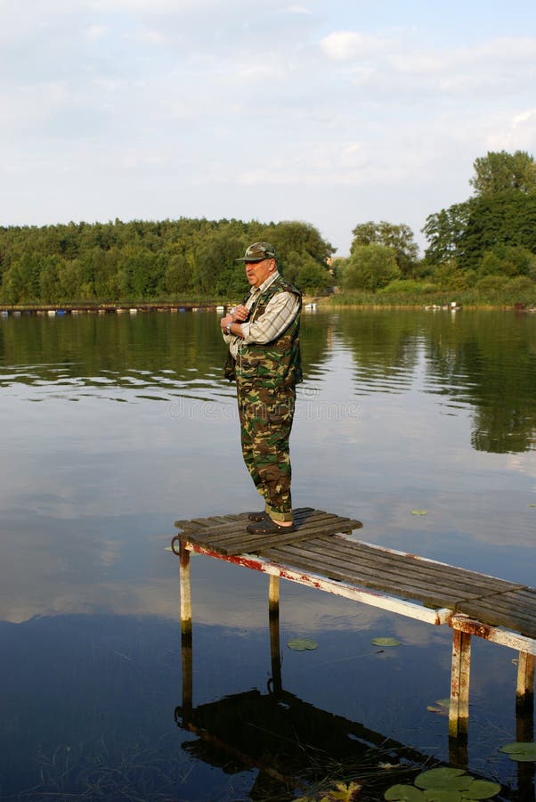 Fisherman looking for fish stock photo. Image of aged - 10770134