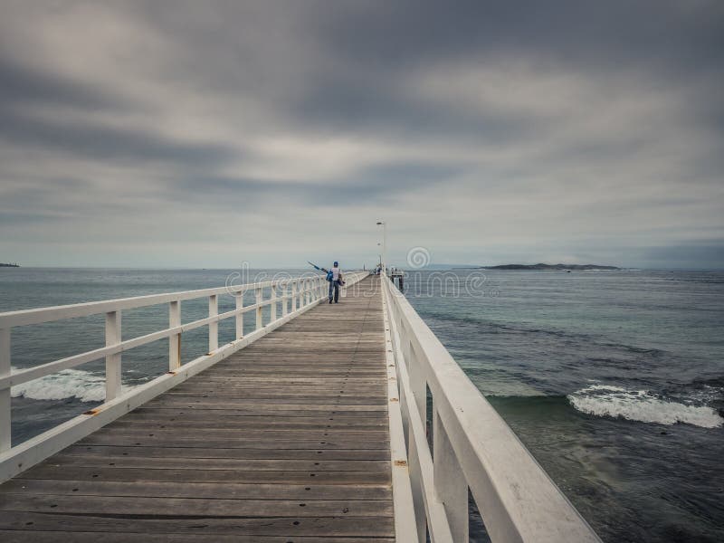 Fisherman on Pier or Jetty stock image. Image of australia - 89372203