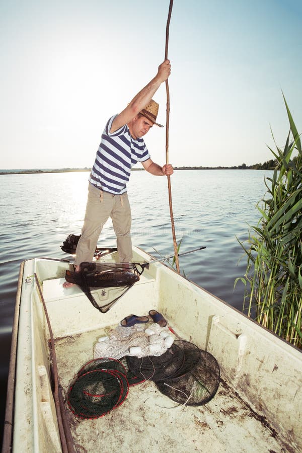 Pushing Out a Row Boat with Nets Stock Photo - Image of relax, starfish ...