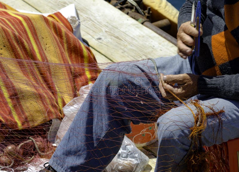 Fisherman Repairing a Fishing Net Stock Image - Image of commercial ...