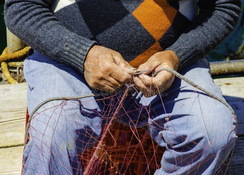 Fisherman repairs his net stock image. Image of poor - 42038491