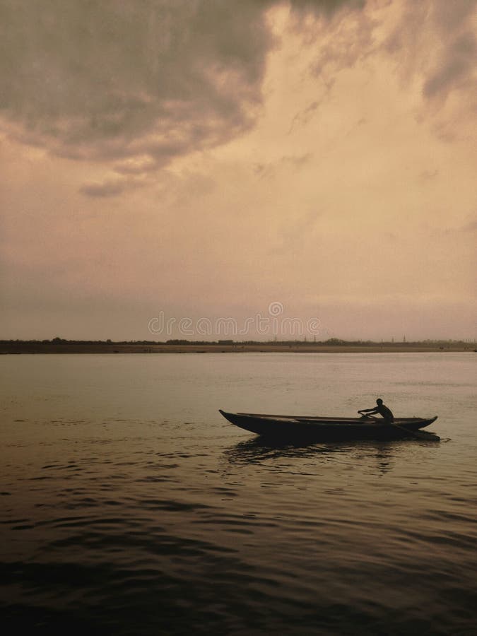 A Fisherman Rowing the Boat Stock Photo - Image of boat, rowing: 124356782