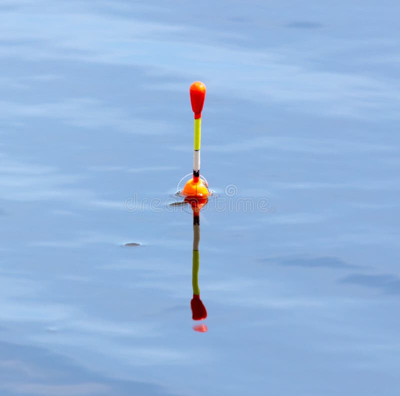 Fisherman S Float on the Blue Surface of the Water. Stock Photo - Image ...