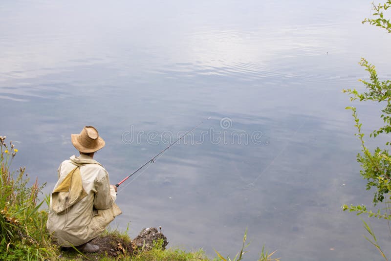 The Fisherman Sits by the Lake. Back View Stock Photo - Image of catch ...