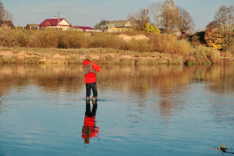 A Fisherman is Standing in Boots and Fishing Stock Photo - Image of ...
