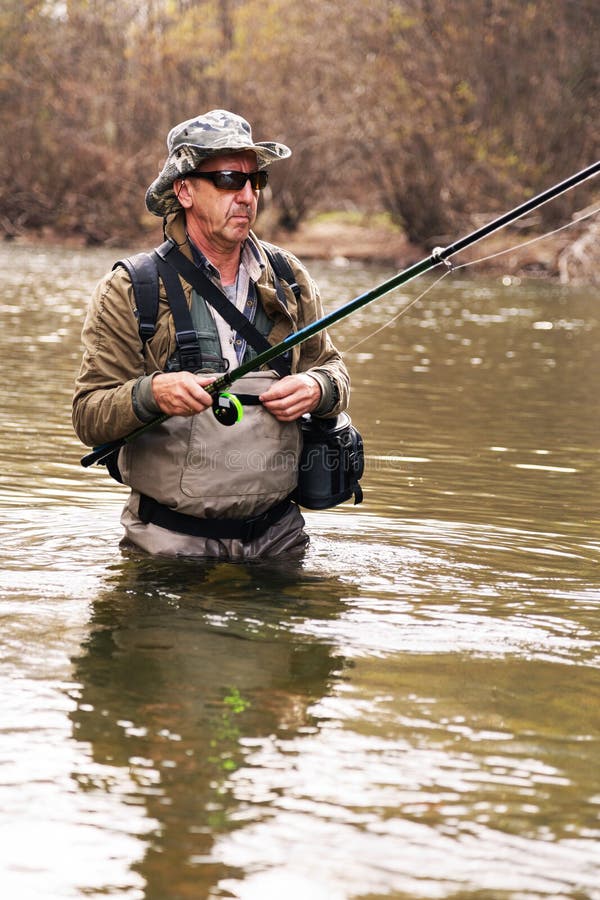 Fisherman Standing in River when Fishing for Grayling Stock Photo ...