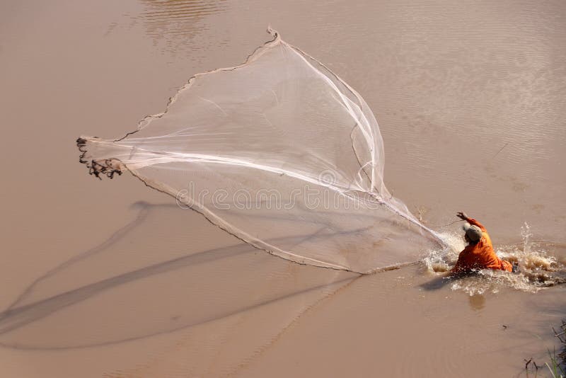 A Fisherman Throwing a Net into the River Editorial Stock Photo - Image ...