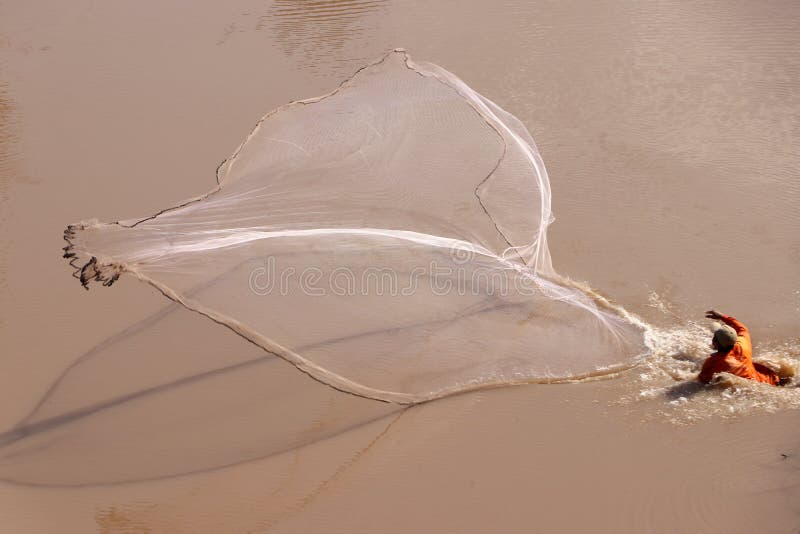 A Fisherman Throwing a Net into the River Editorial Photo - Image of ...