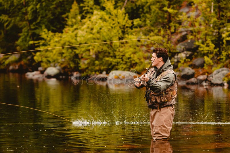 Fisherman Using Rod Fly Fishing in Mountain River Sunset Stock Image ...