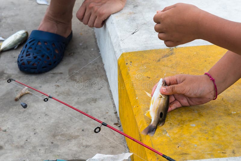 The Fisherman Was Holding a Fish Hook in the Hand. Stock Photo - Image ...