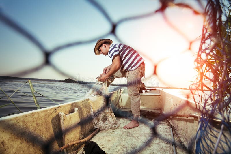 Fisherman at Work, Cleaning the Nets Stock Photo - Image of food, river ...