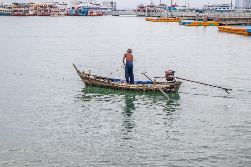 A Fisherman at Work by the Sea Editorial Photo - Image of downtown ...