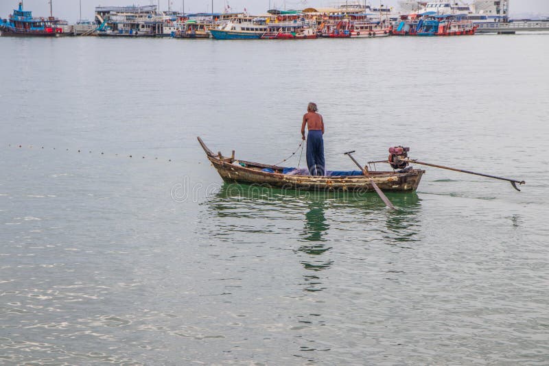A Fisherman at Work by the Sea Editorial Image - Image of article ...