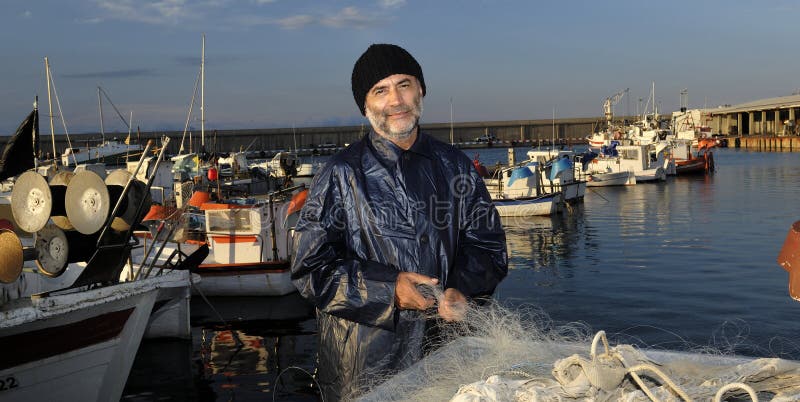 A Fisherman Working in the Fishing Port Stock Photo - Image of ...
