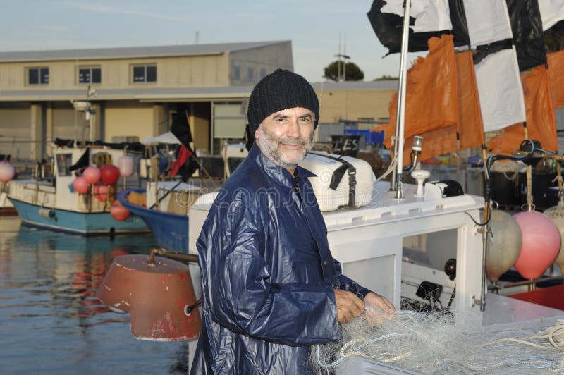 Fisherman Working in the Fishing Port Stock Photo - Image of light ...