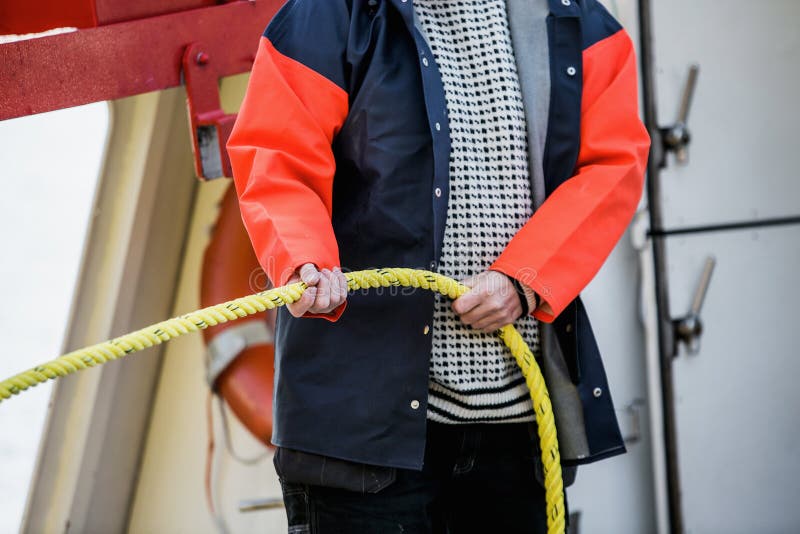 The Fisherman Works with the Rigging Stock Photo - Image of fisherman ...